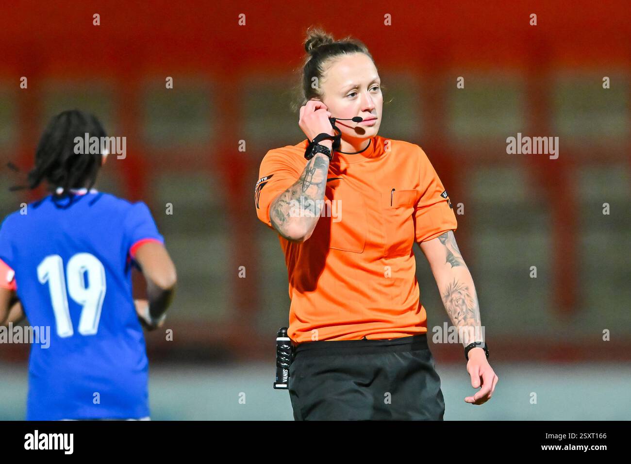 Referee Megan Wilson (Match referee) holds headpiece during the ...