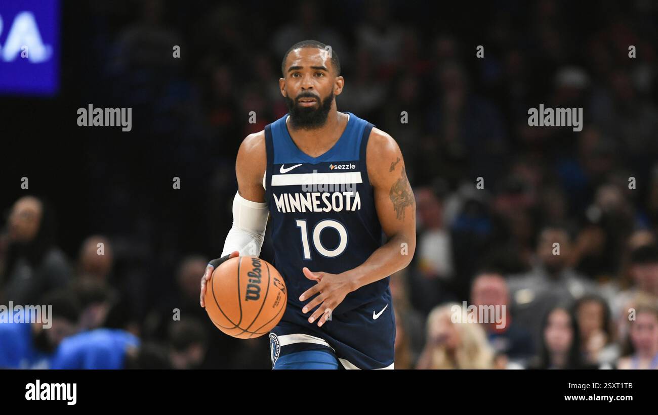 Minnesota Timberwolves guard Mike Conley pushes down the court during ...