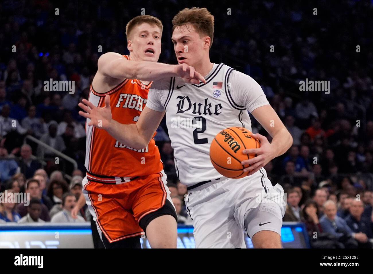 Duke's Cooper Flagg (2) drives past Illinois' Ben Humrichous (3) during ...