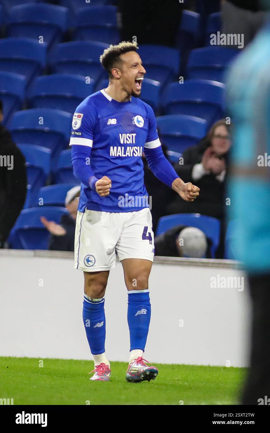 Cardiff, UK. 25th Feb, 2025. Callum Robinson of Cardiff City celebrates ...