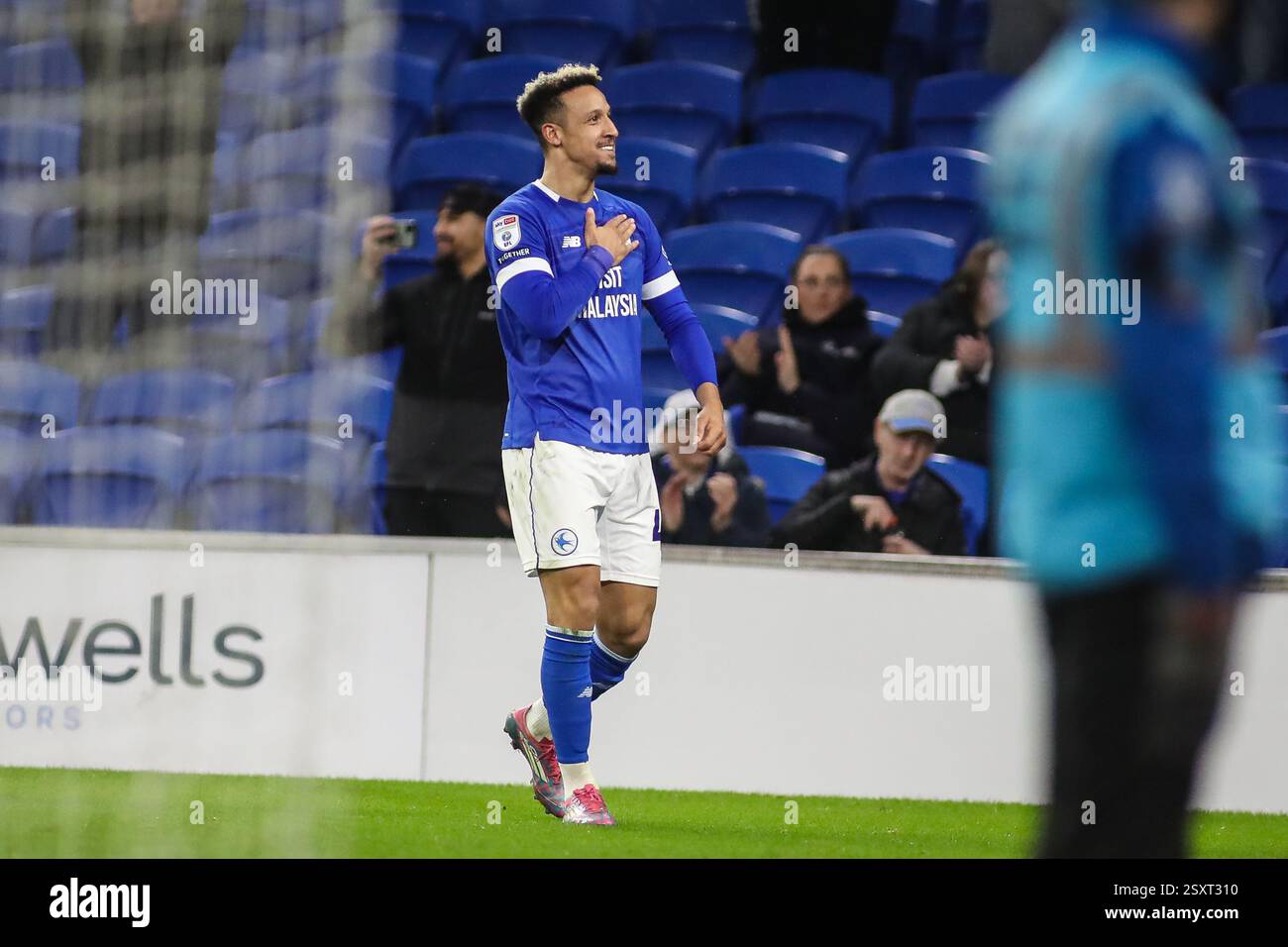 Cardiff, UK. 25th Feb, 2025. Callum Robinson of Cardiff City celebrates ...