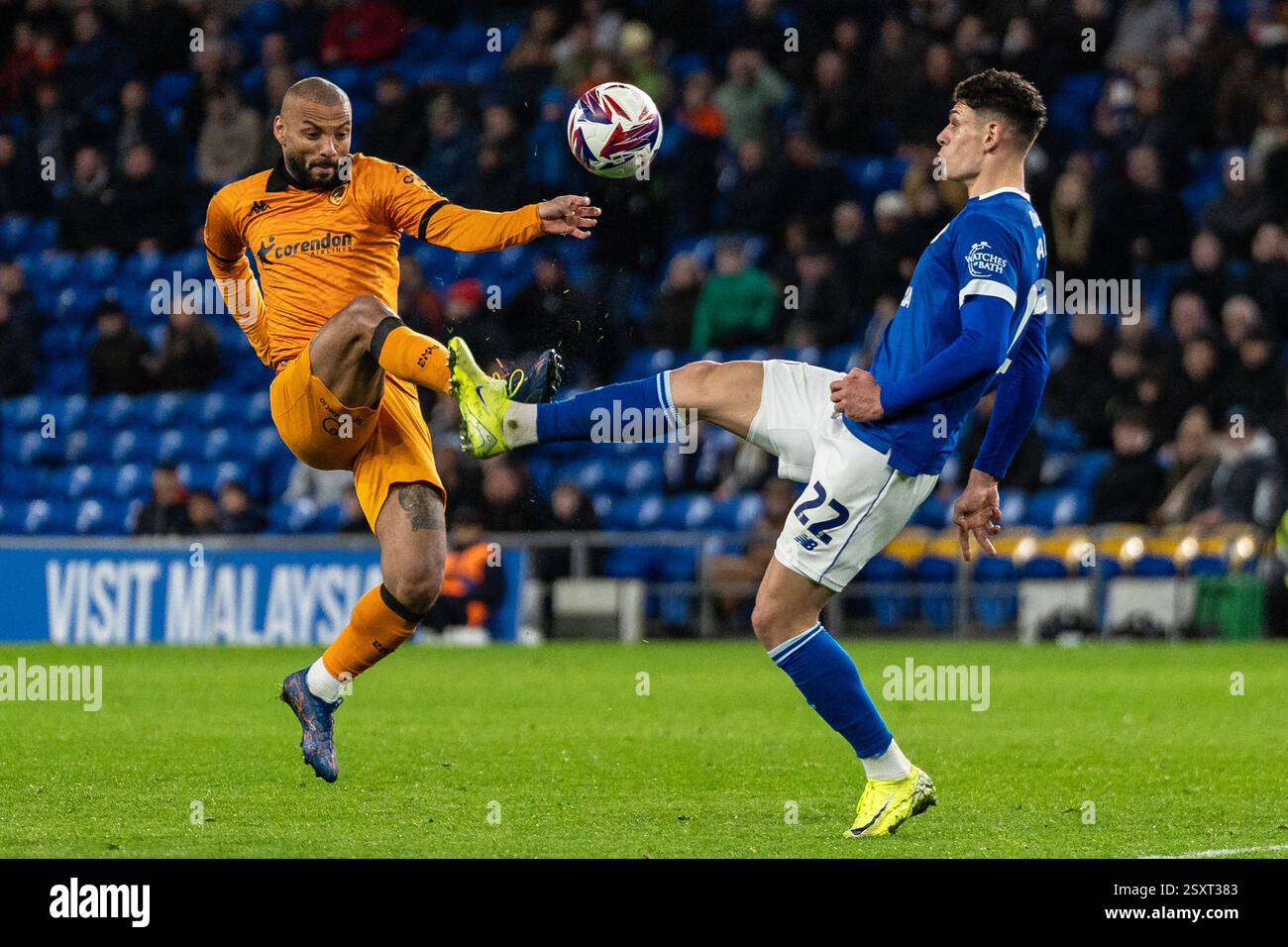 Yousef Salech of Cardiff City and Nordin Amrabat of Hull City compete ...