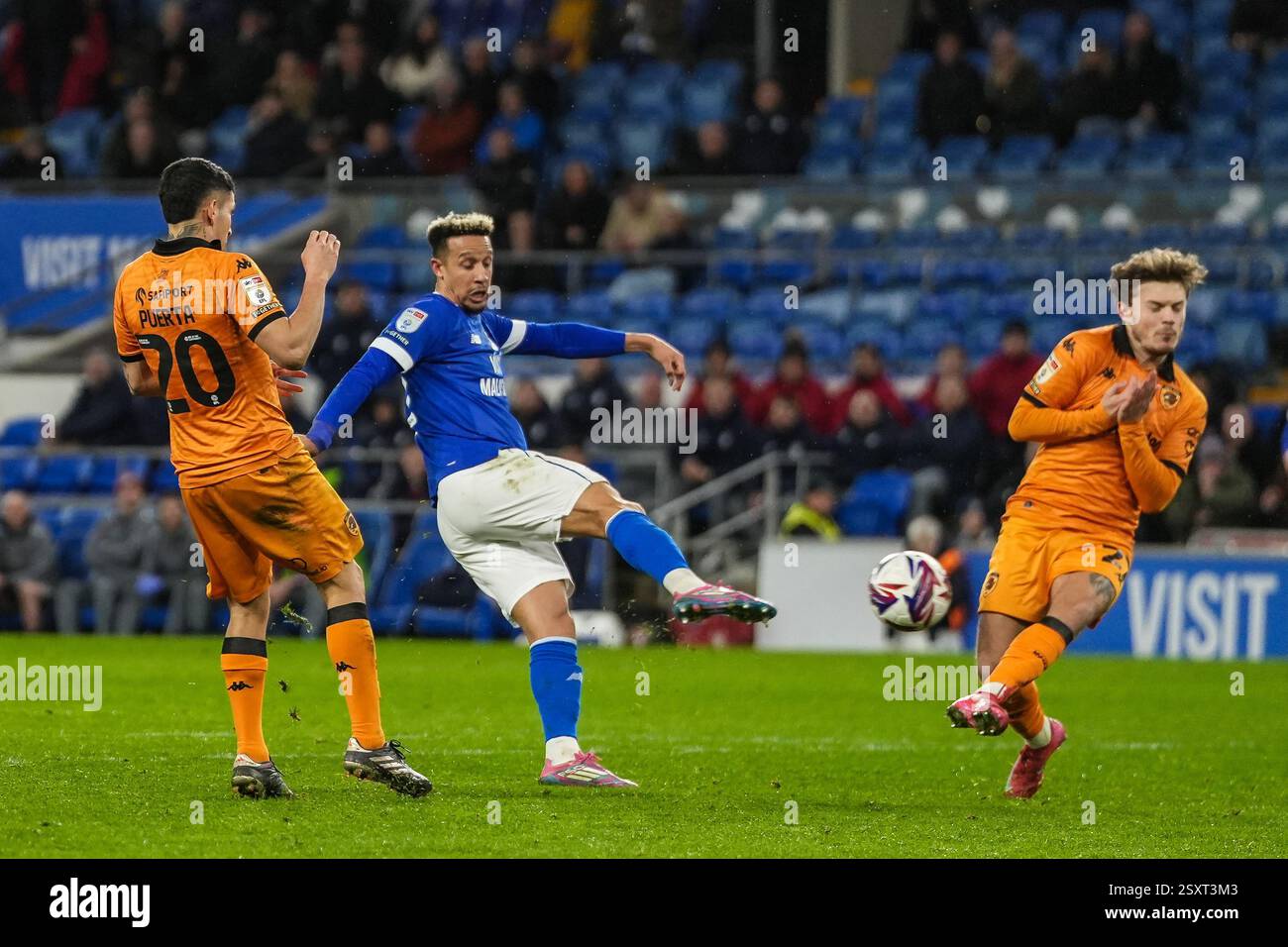 Cardiff, UK. 25th Feb, 2025. Callum Robinson of Cardiff City scores his ...