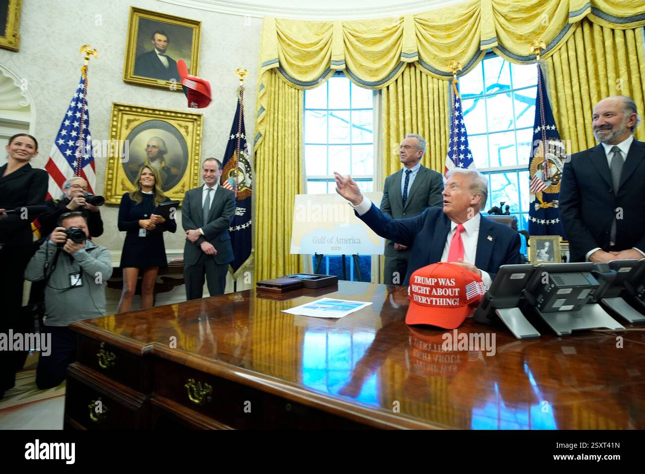 US President Donald Trump throws a hat to reporters reading "Trump was ...