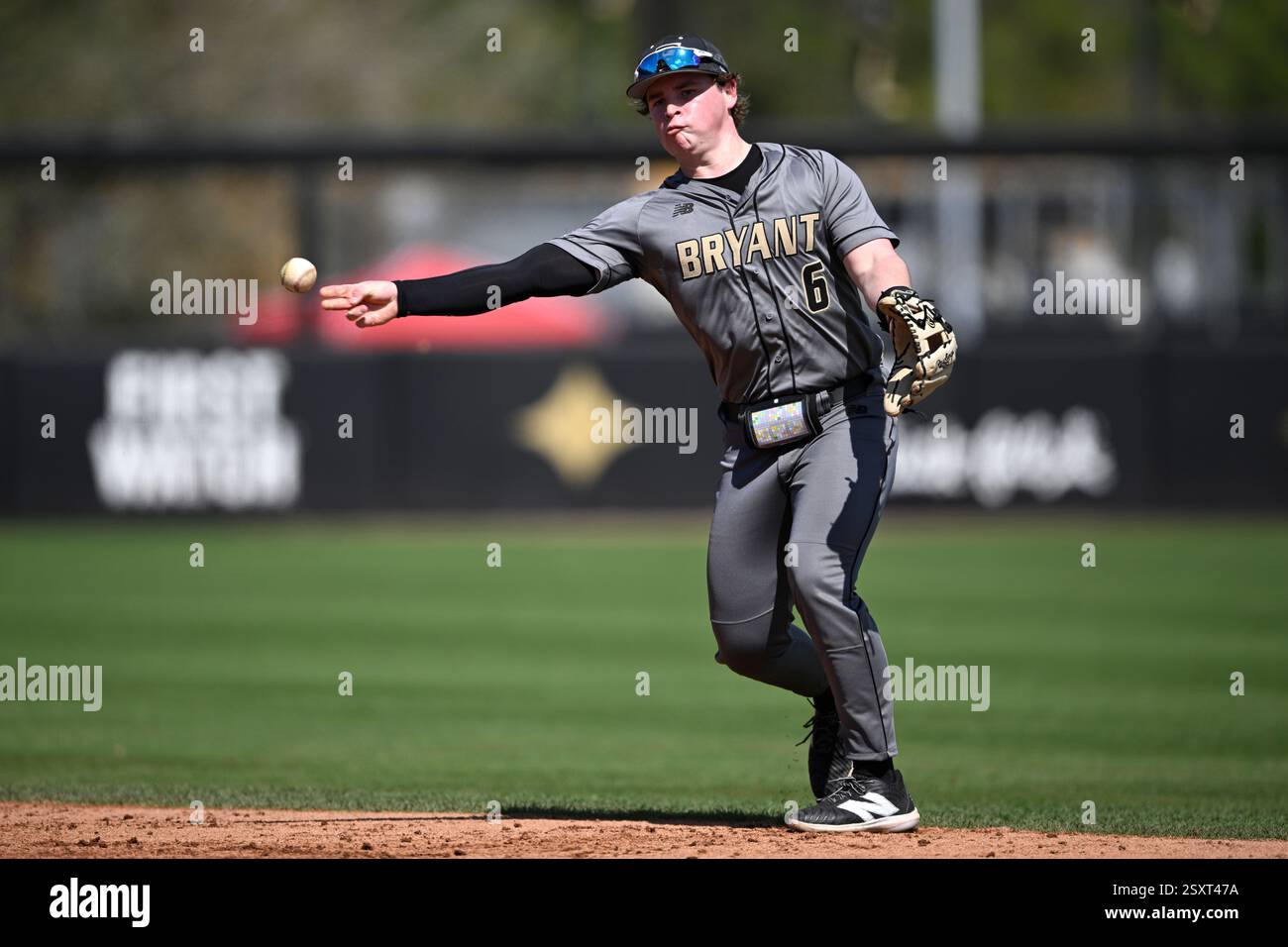 Bryant infielder Eliot Medlock (6) throws during an NCAA college ...