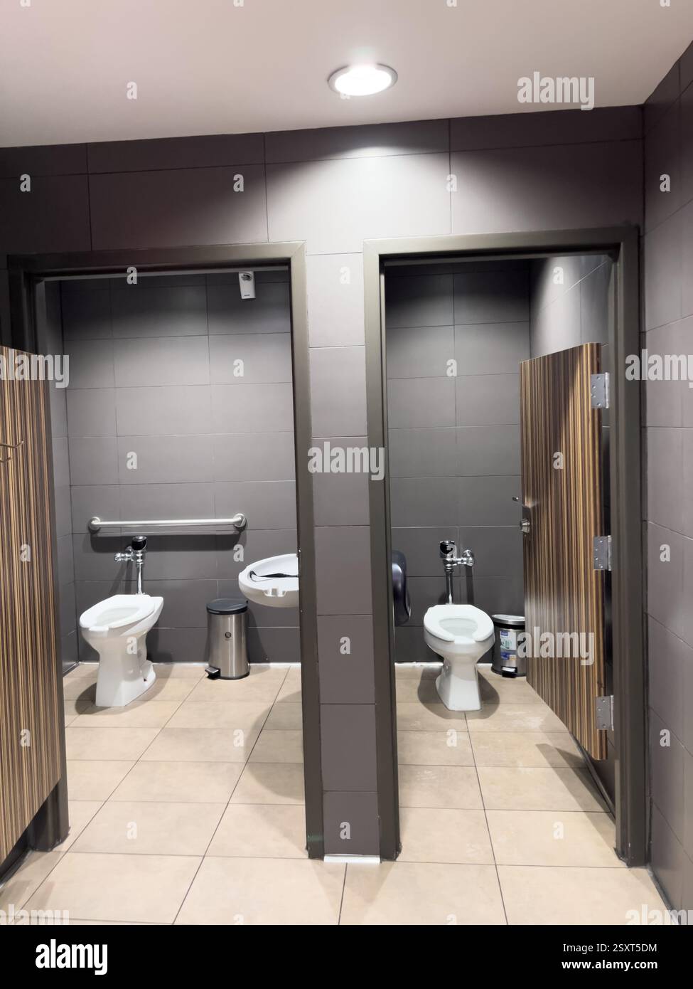 Clean Public Restroom Stalls With White Toilets Stock Photo - Alamy