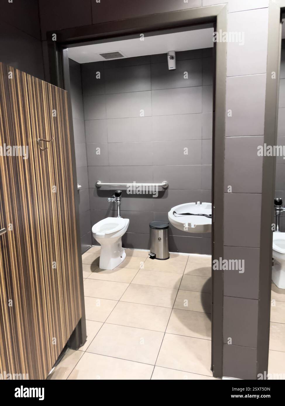 Clean Public Restroom Stalls With White Toilets Stock Photo - Alamy