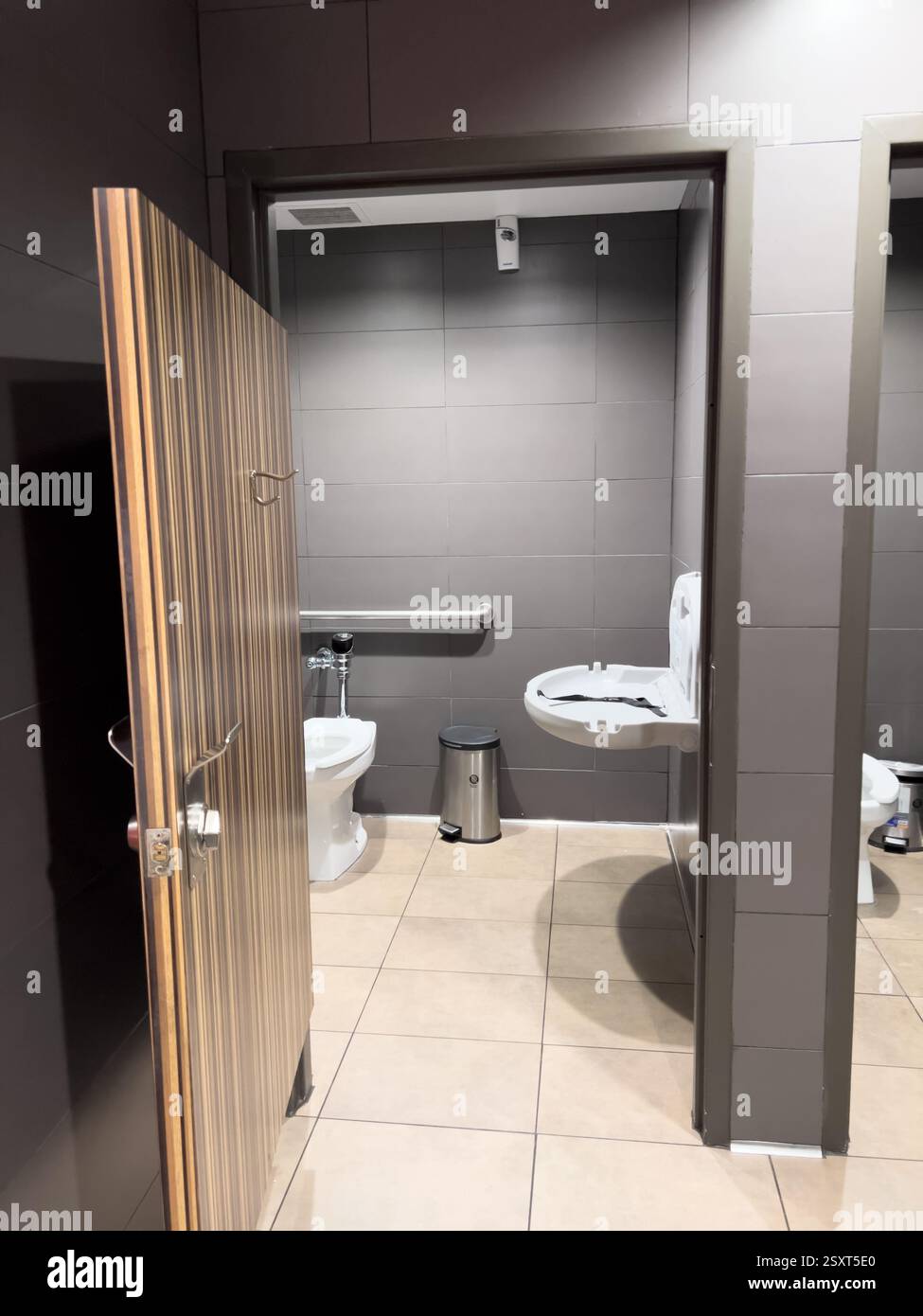 Clean Public Restroom Stalls With White Toilets Stock Photo - Alamy