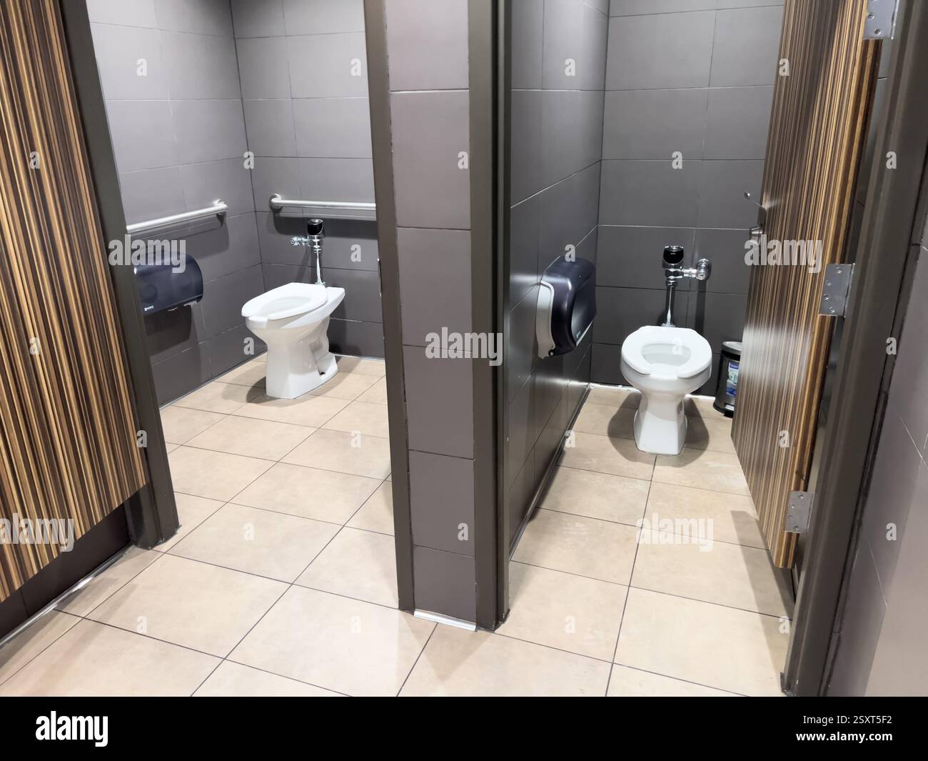 Clean Public Restroom Stalls With White Toilets Stock Photo - Alamy