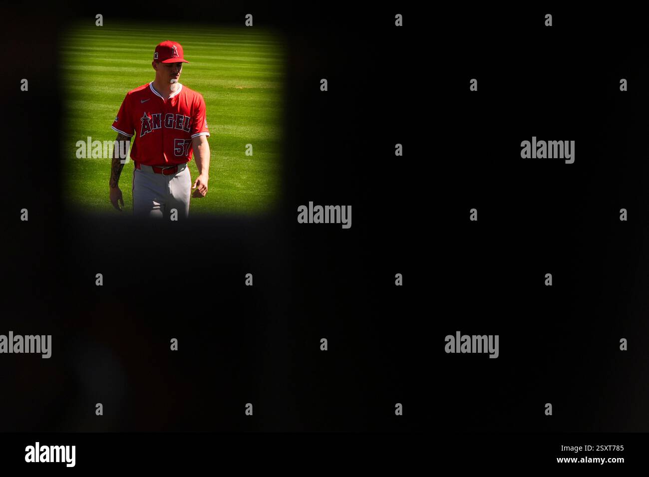 Los Angeles Angels relief pitcher Garrett McDaniels walks on the field ...
