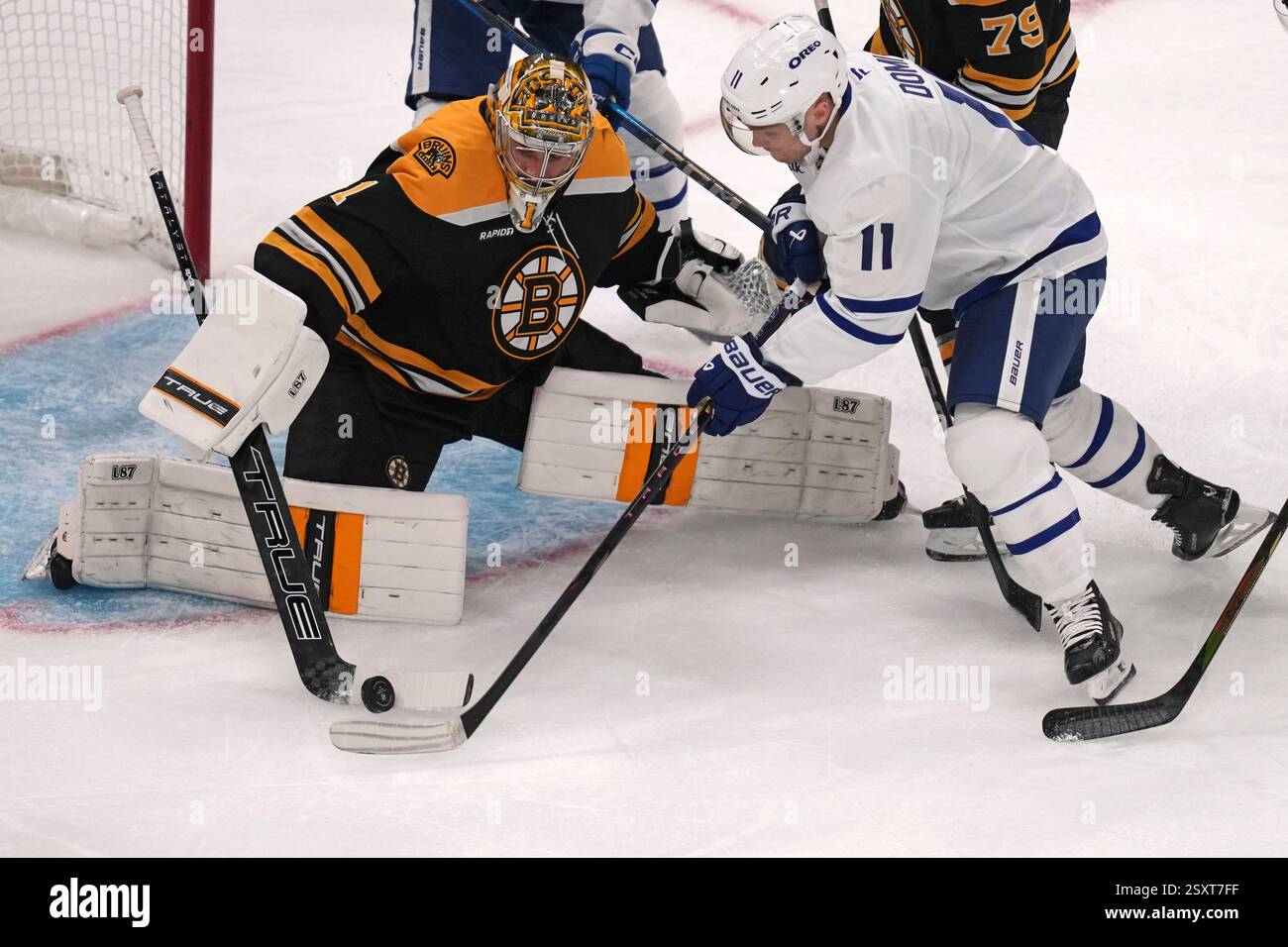 Boston Bruins goaltender Jeremy Swayman (1) makes a save on a shot by ...