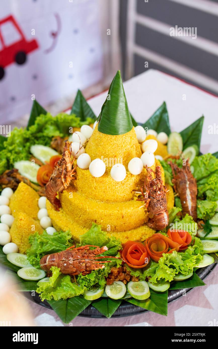 Nasi tumpeng. Indonesian traditional food served for traditional ...