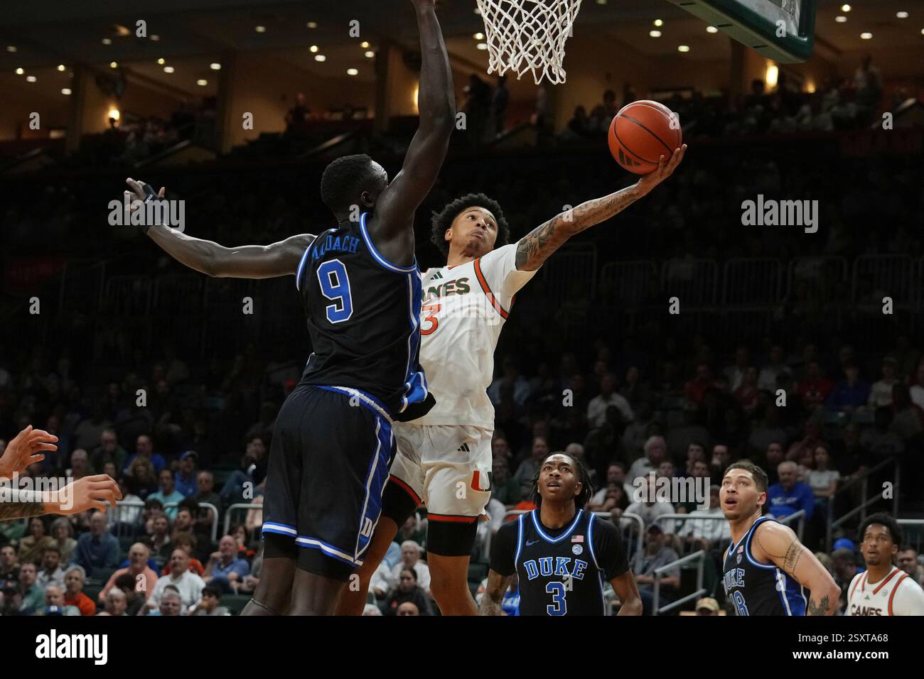 Miami guard Jalil Bethea (3) drives to the basket as Duke center Khaman ...
