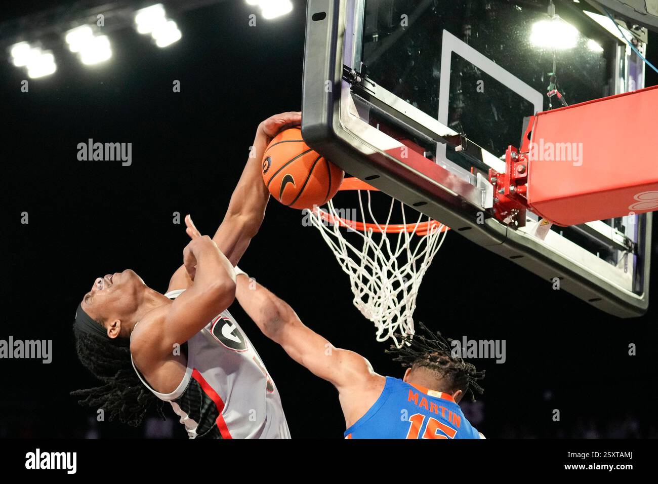 Georgia guard Silas Demary Jr. (5) puts up the ball against Florida ...
