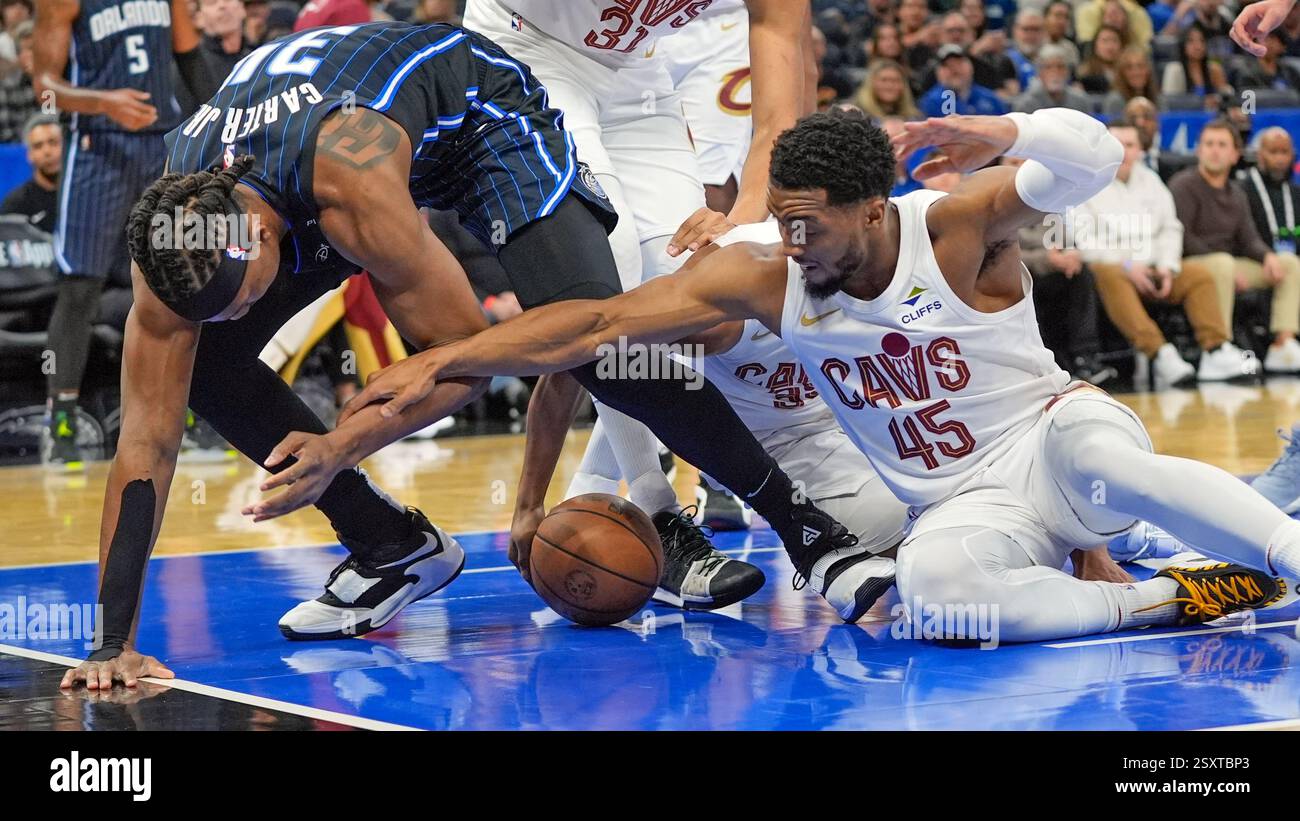 Orlando Magic center Wendell Carter Jr., left, goes after a loose ball ...