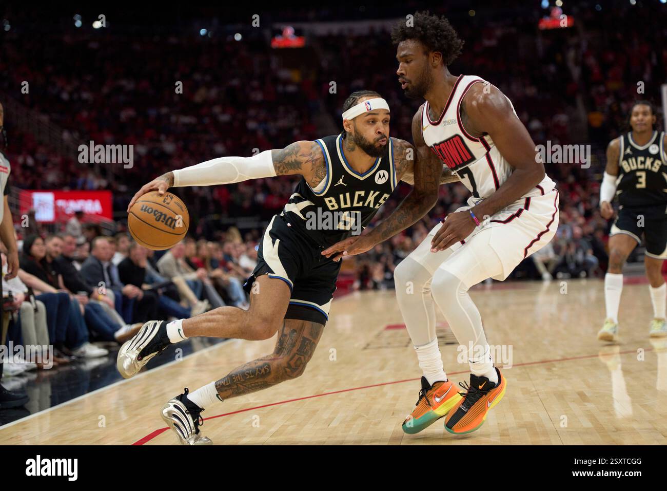 Milwaukee Bucks' Gary Trent Jr. (5) drives toward the basket as Houston ...