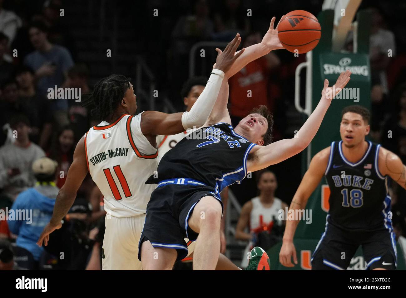 Duke guard Kon Knueppel (7) attempts to block a pass by Miami guard A.J ...