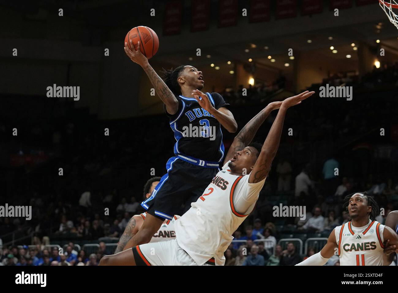 Duke guard Isaiah Evans (3) drives to the basket over Miami forward ...