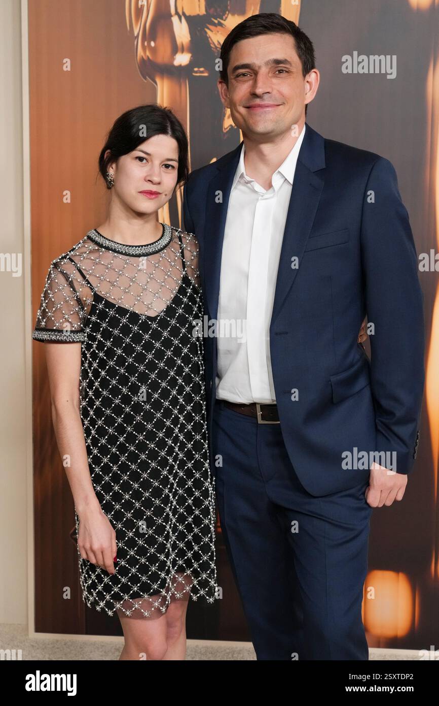 Juliette Marquet, left, and Loic Espuche arrive at the Oscars Nominees Dinner on Tuesday, Feb ...