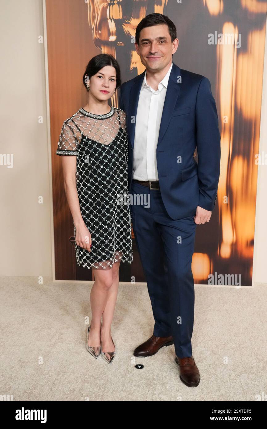 Juliette Marquet, left, and Loic Espuche arrive at the Oscars Nominees Dinner on Tuesday, Feb ...