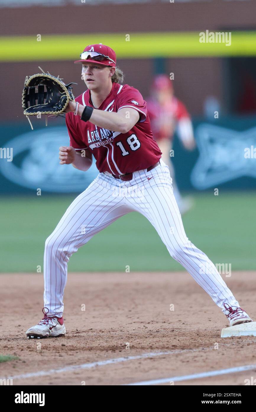 February 25, 2025: Reese Robinett (18) of Arkansas covers the bag at ...