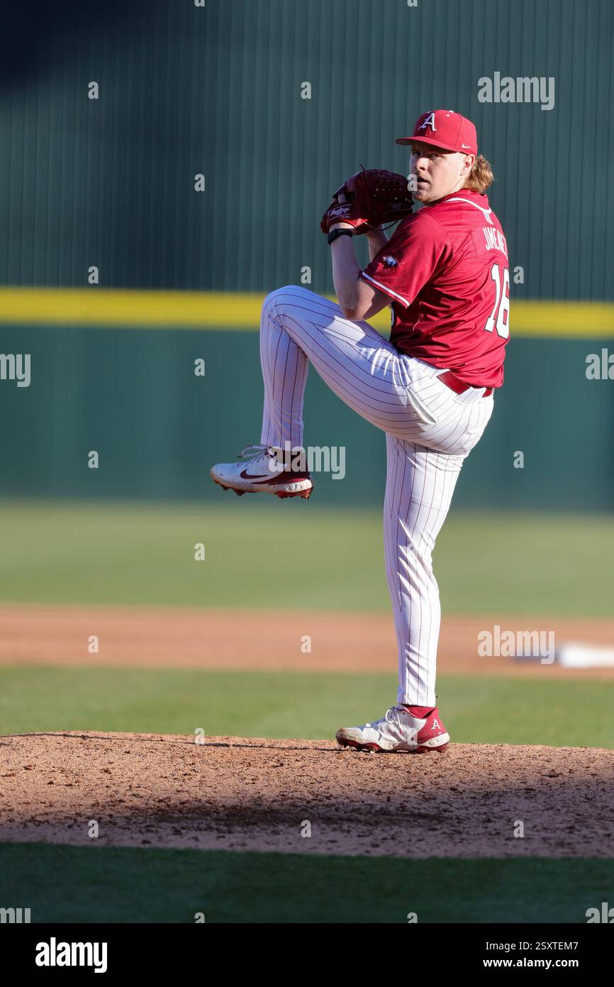 February 25, 2025: Aiden Jimenez (16) Arkansas pitcher begins his wind ...