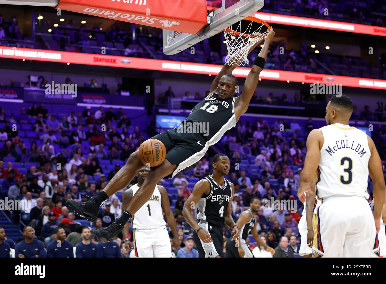 San Antonio Spurs center Bismack Biyombo (18) dunks the ball over New ...