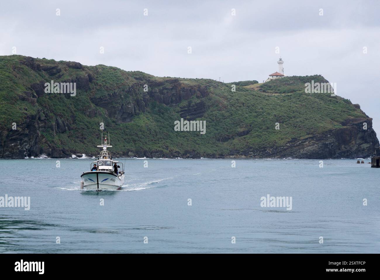 A fishing boat returns from a catch on Yonaguni, a tiny island on Japan ...