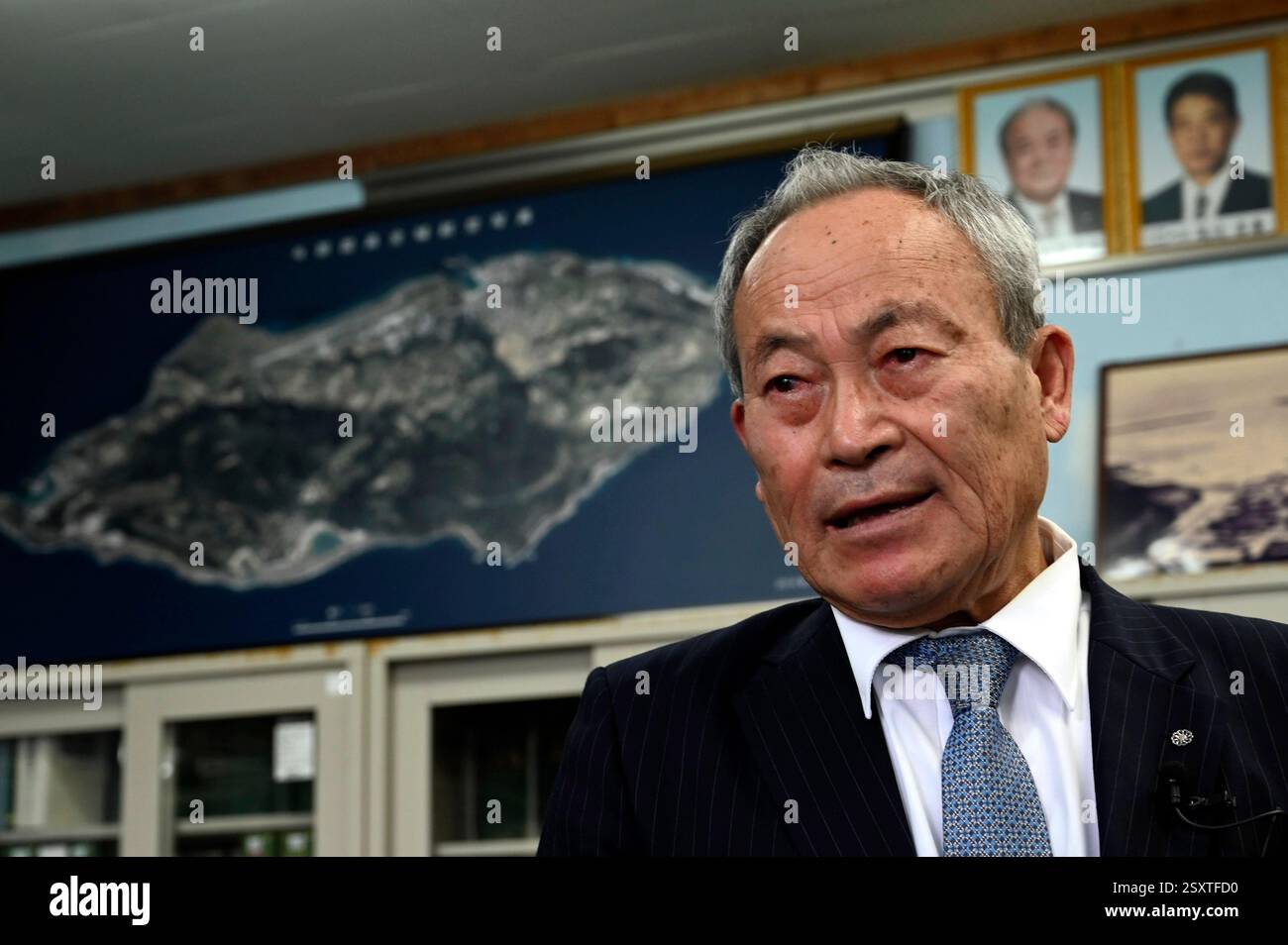 Yonaguni Mayor Kenichi Itokazu speaks during an interview with the AP ...