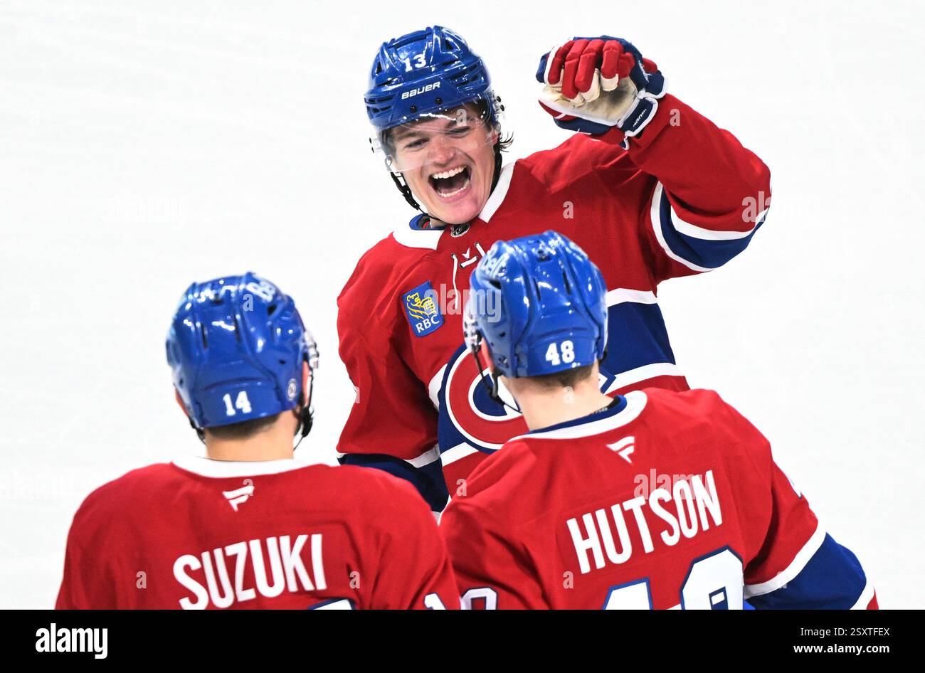 Montreal Canadiens' Lane Hutson (48) celebrates with teammates Nick ...