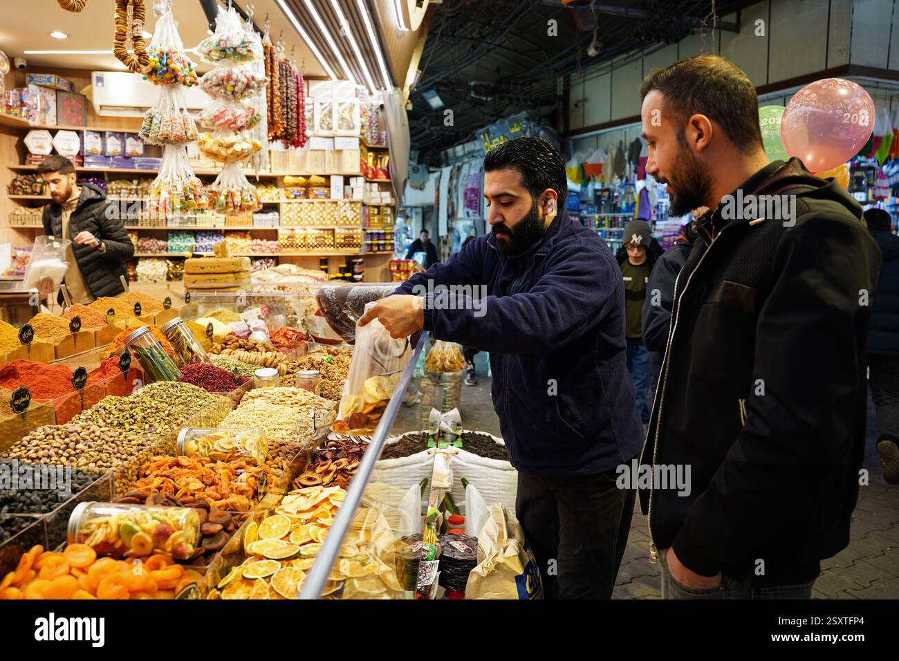 Duhok, Iraq. 25th Feb, 2025. An Iraqi Kurdish vendor sells spices in ...