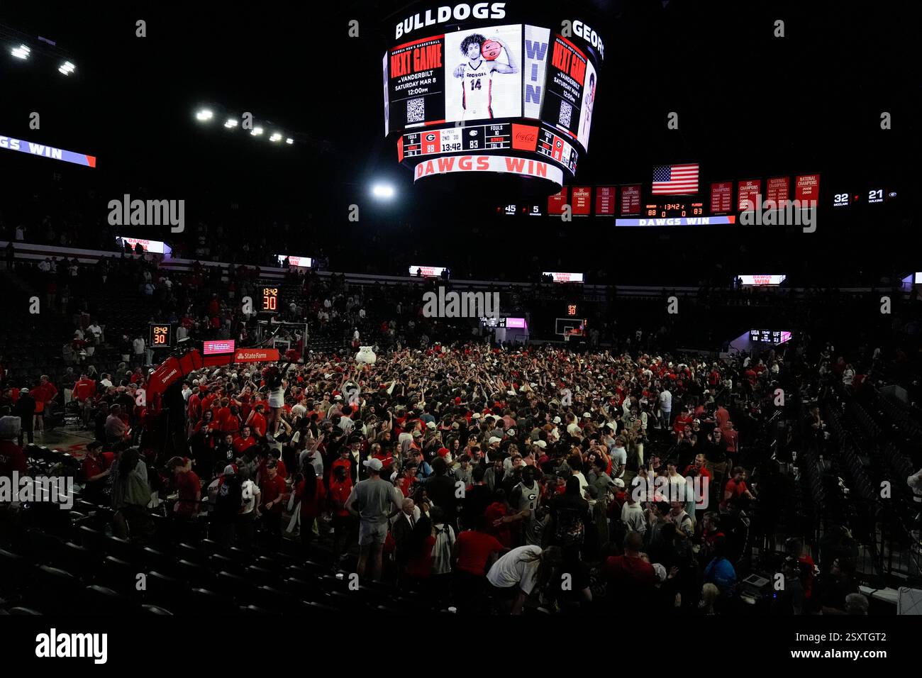 Georgia fans rush the court in celebration after an NCAA college ...