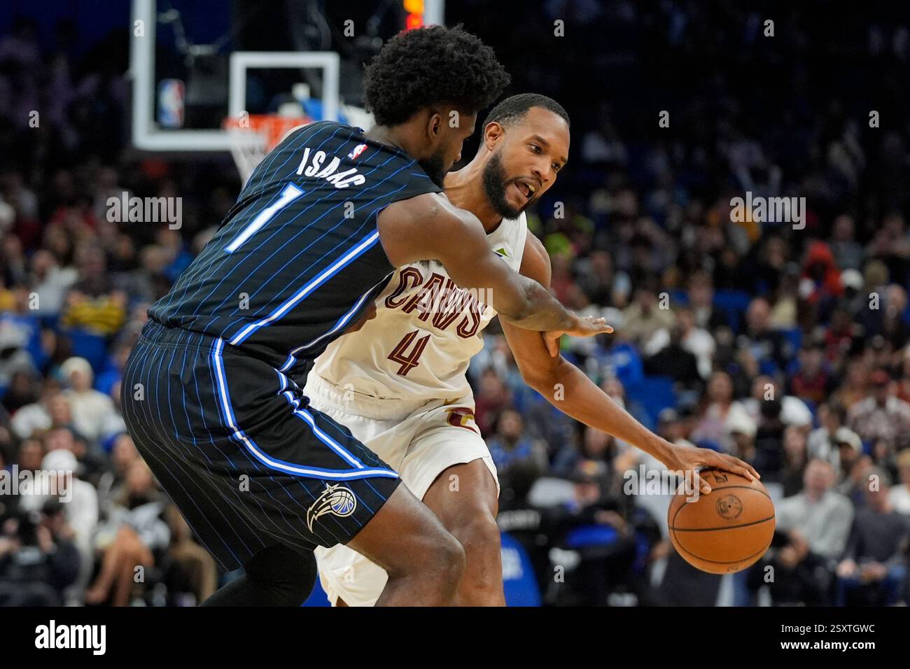 Cleveland Cavaliers forward Evan Mobley (4) collides with Orlando Magic ...