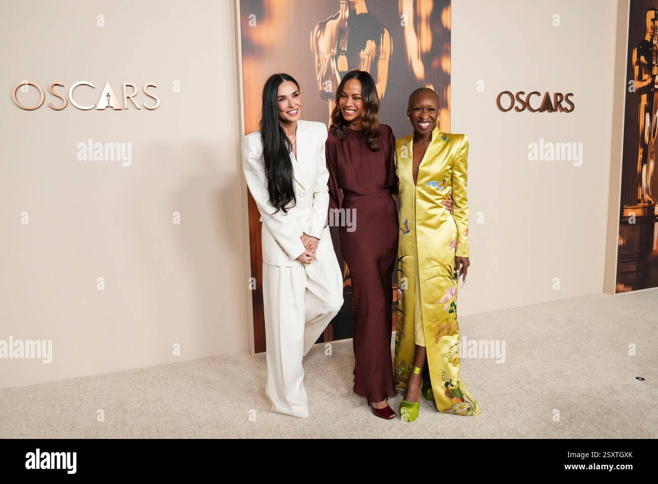 Demi Moore, from left, Zoe Saldana, and Cynthia Erivo arrive at the ...