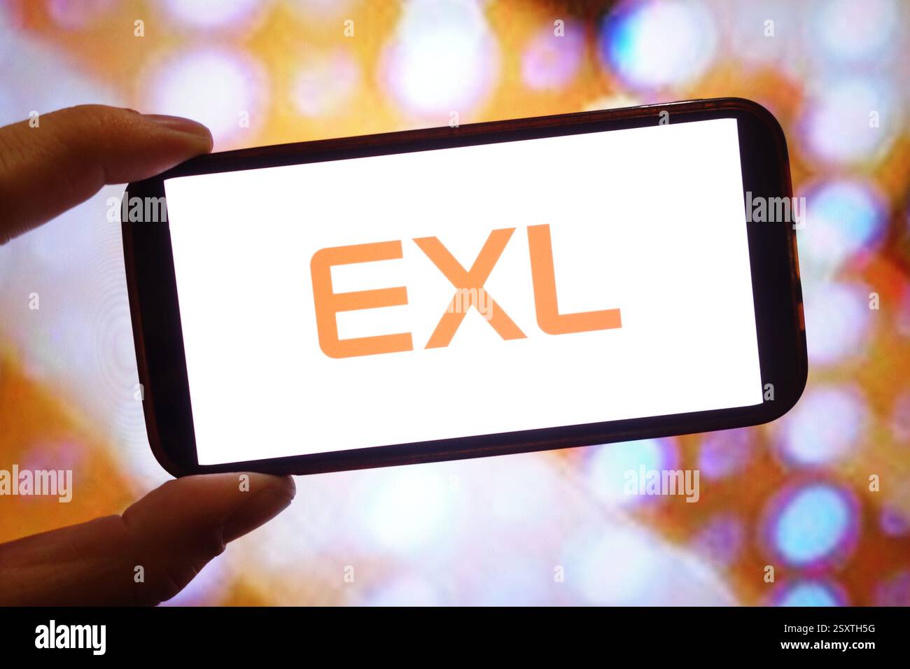 In this photo illustration, the EXL Service company logo is seen ...