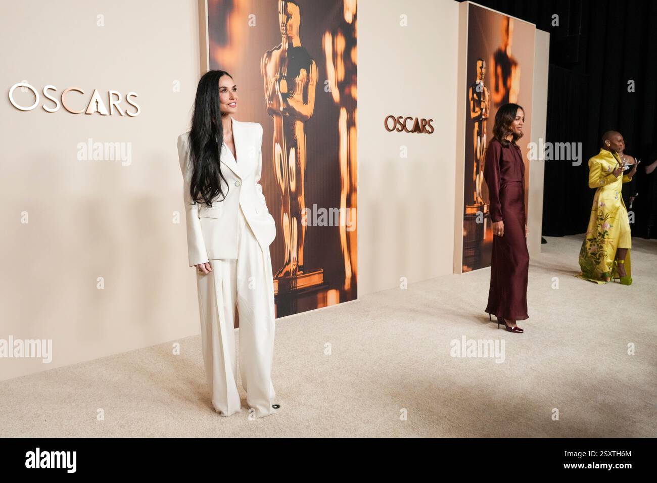 Demi Moore, from left, Zoe Saldana, and Cynthia Erivo arrive at the ...