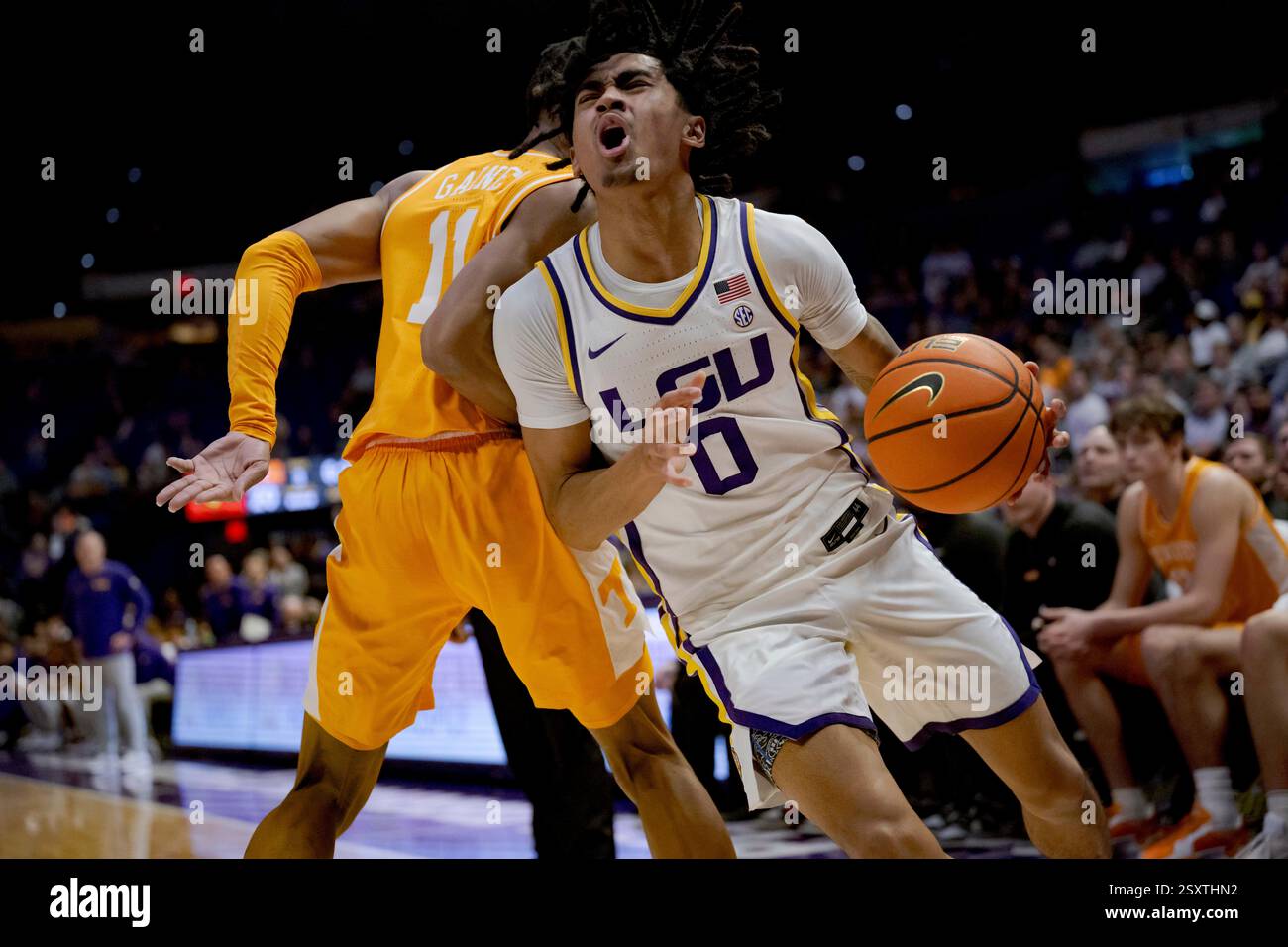 LSU guard Vyctorius Miller (0) collides with Tennessee guard Jordan ...