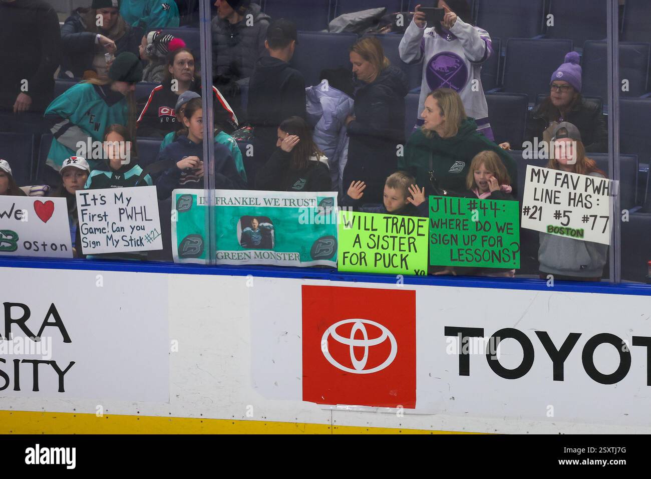 Buffalo, New York, USA. 23rd Feb, 2025. Fans hold up signs cheering on ...