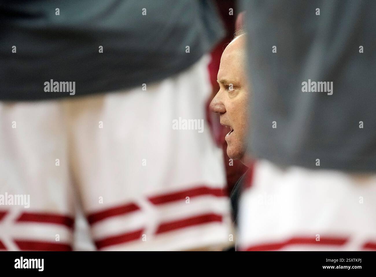 Wisconsin head coach Greg Gard talks with his team during a timeout ...