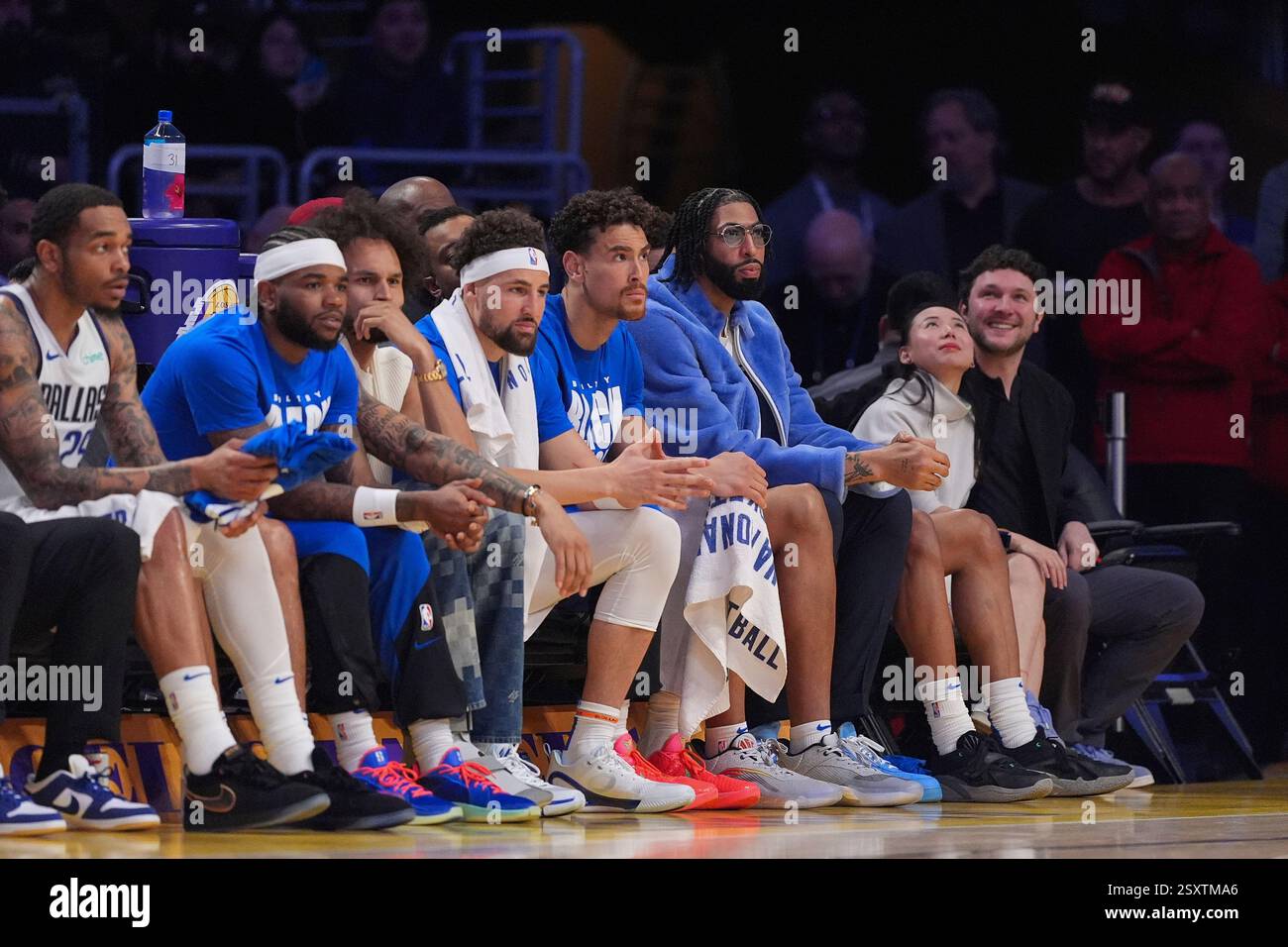 Dallas Mavericks forward Anthony Davis, third from right, watches from ...