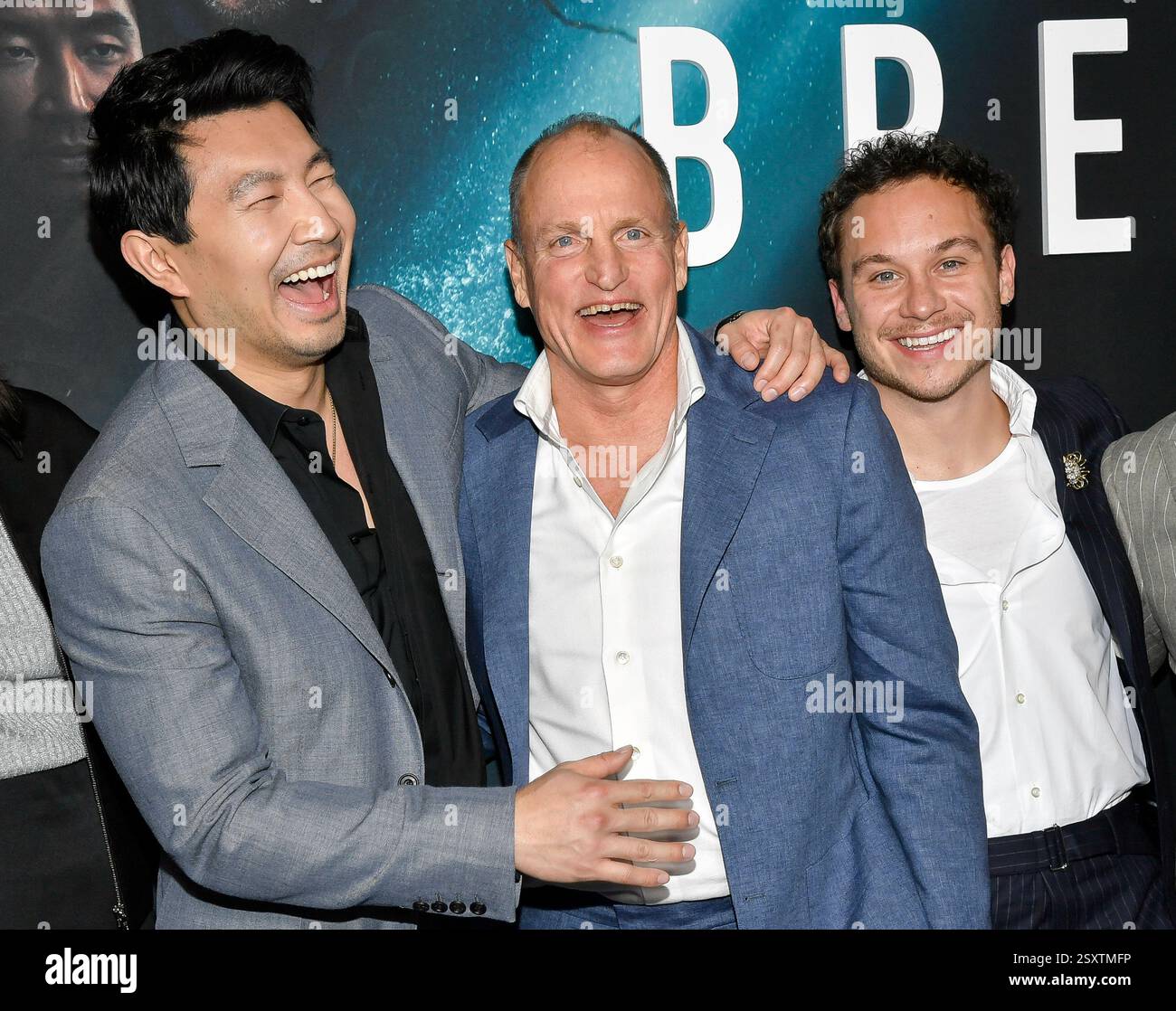 Simu Liu, left, Woody Harrelson and Finn Cole attend the premiere of ...