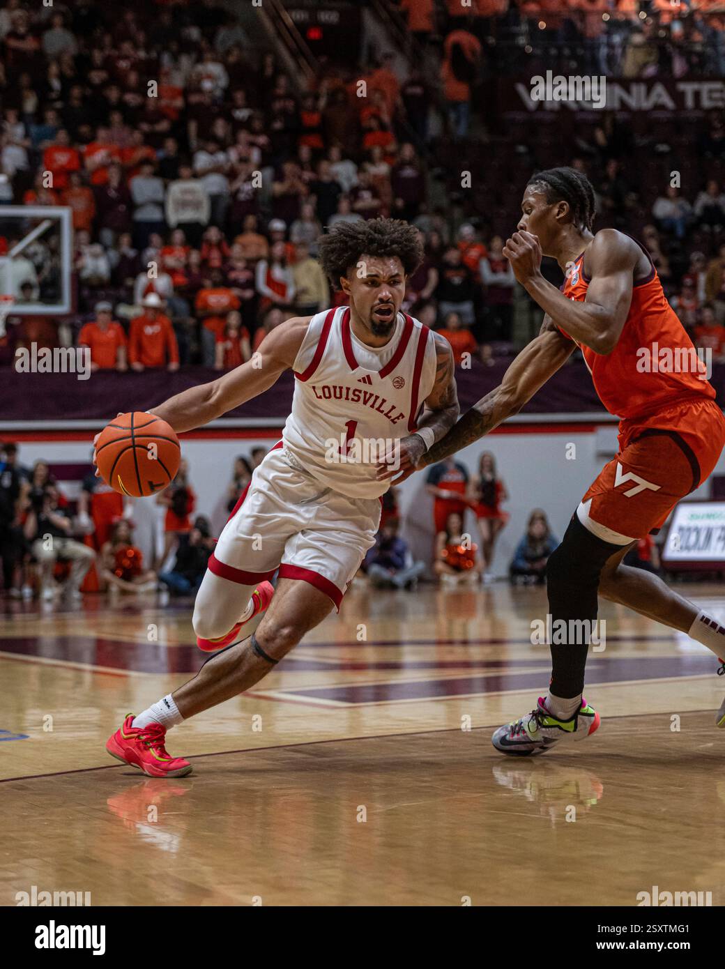 Louisville's J'Vonne Hadley (1) drives by Virginia Tech's Conner ...
