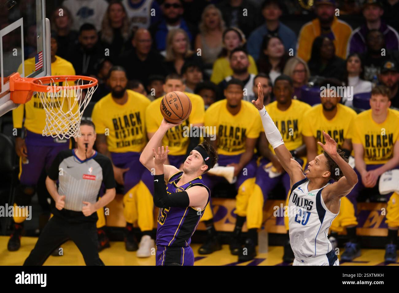 Los Angeles Lakers guard Austin Reaves, left, shoots next to Dallas ...