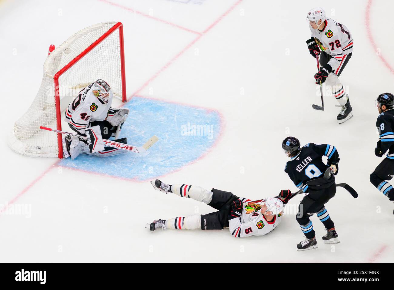 Utah Hockey Club center Clayton Keller (9) shoots and scores a goal on ...