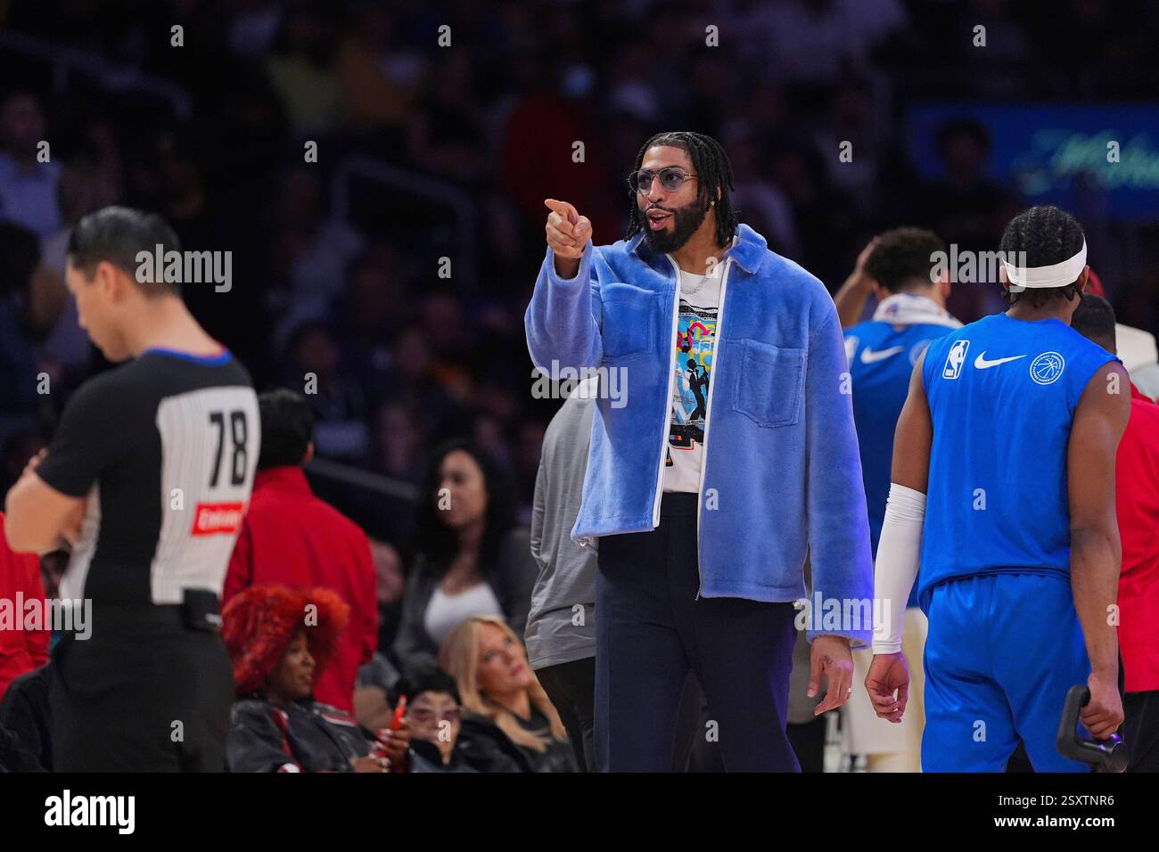 Dallas Mavericks forward Anthony Davis, center, gestures during the ...