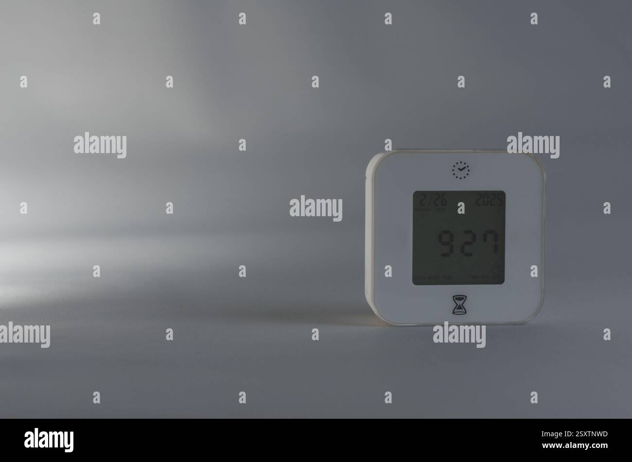 Digital Clock on Minimalist Background Displaying Time and Date in ...