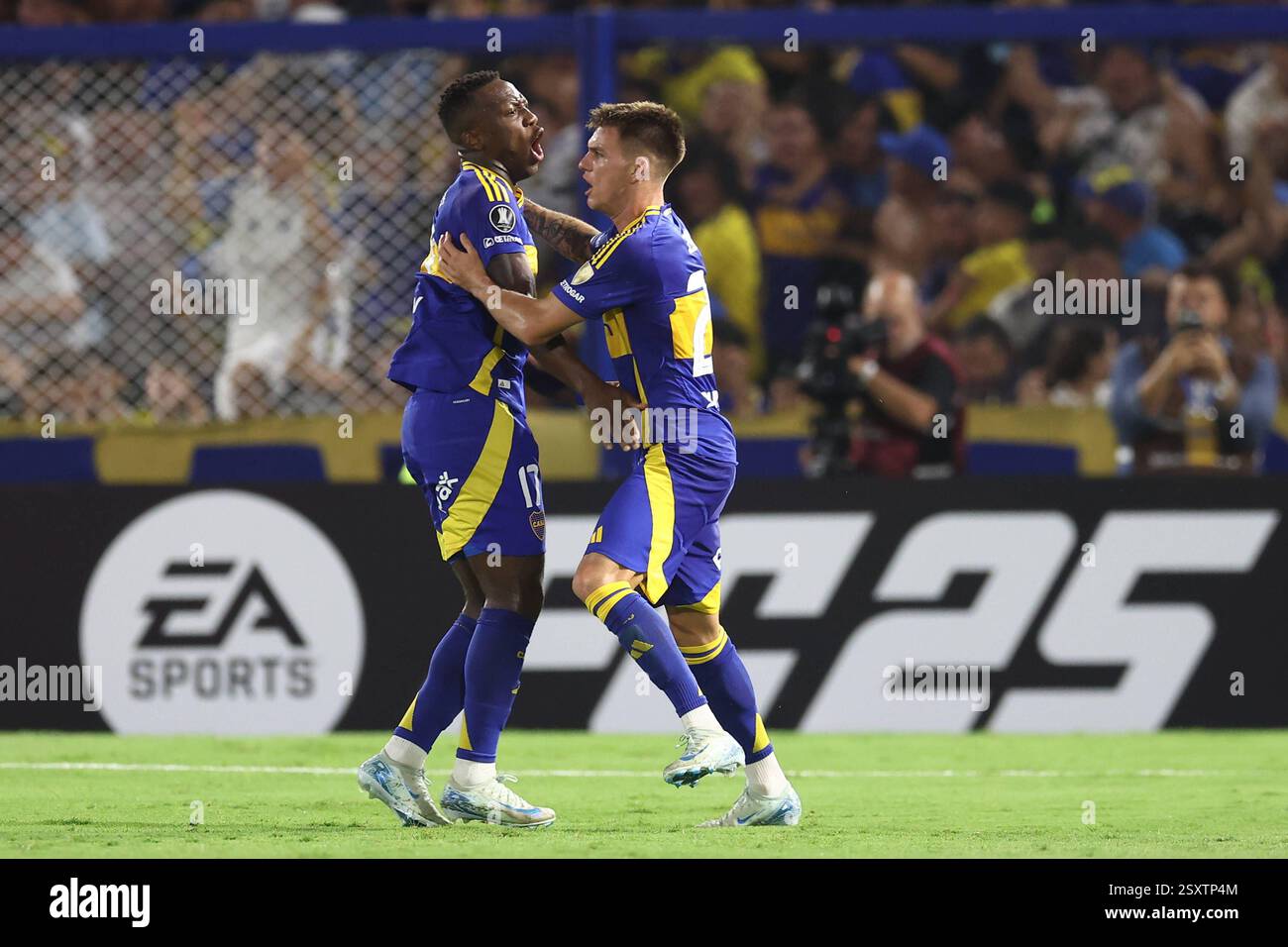 Boca Juniors midfielder Kevin Zenon R celebrates after scoring the ...