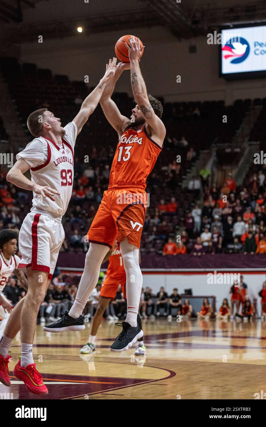 Virginia Tech's Ben Burnham (13) shoots over Louisville's Noah Waterman ...