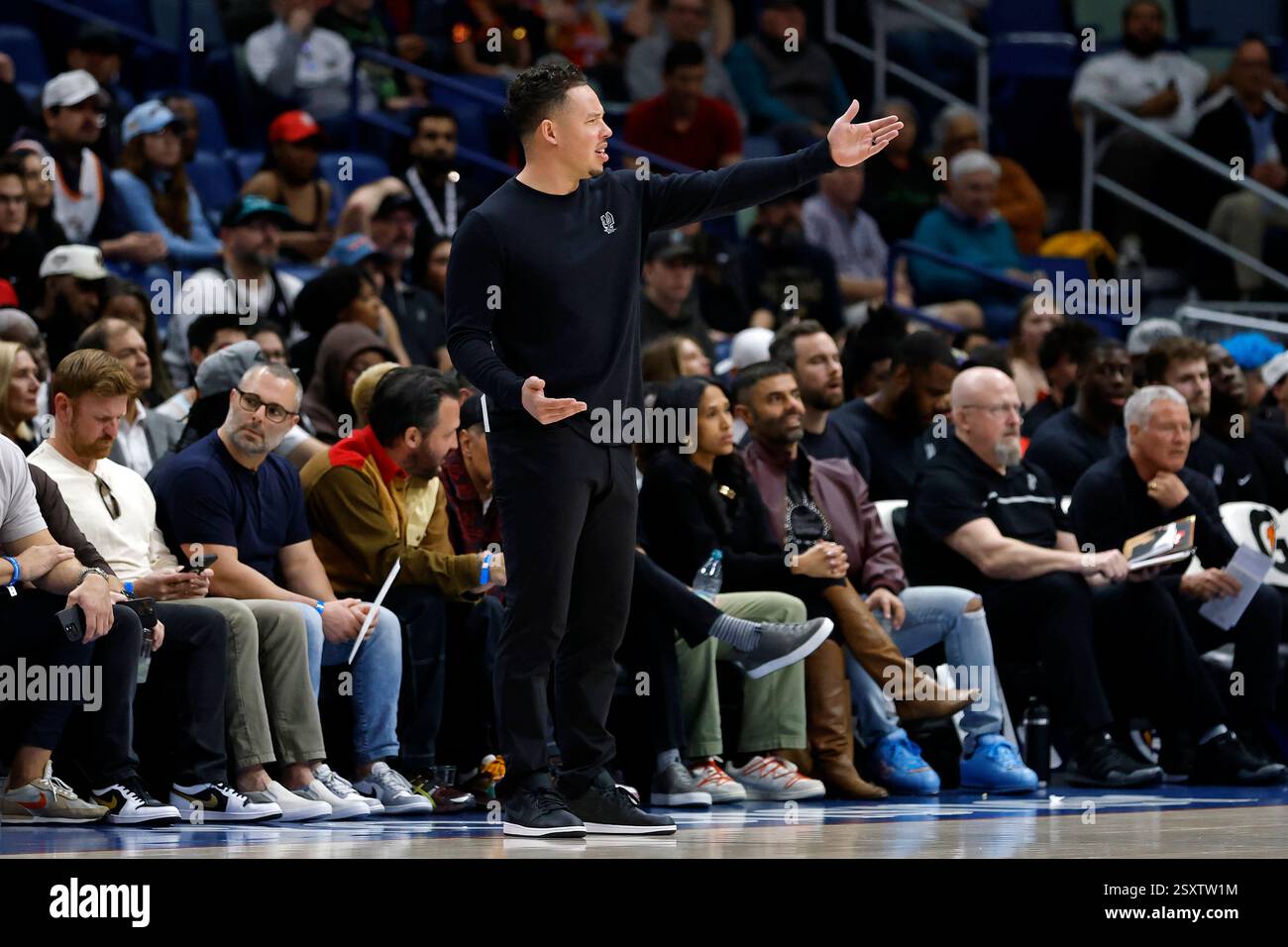 San Antonio Spurs interim coach Mitch Johnson reacts to a play in the ...