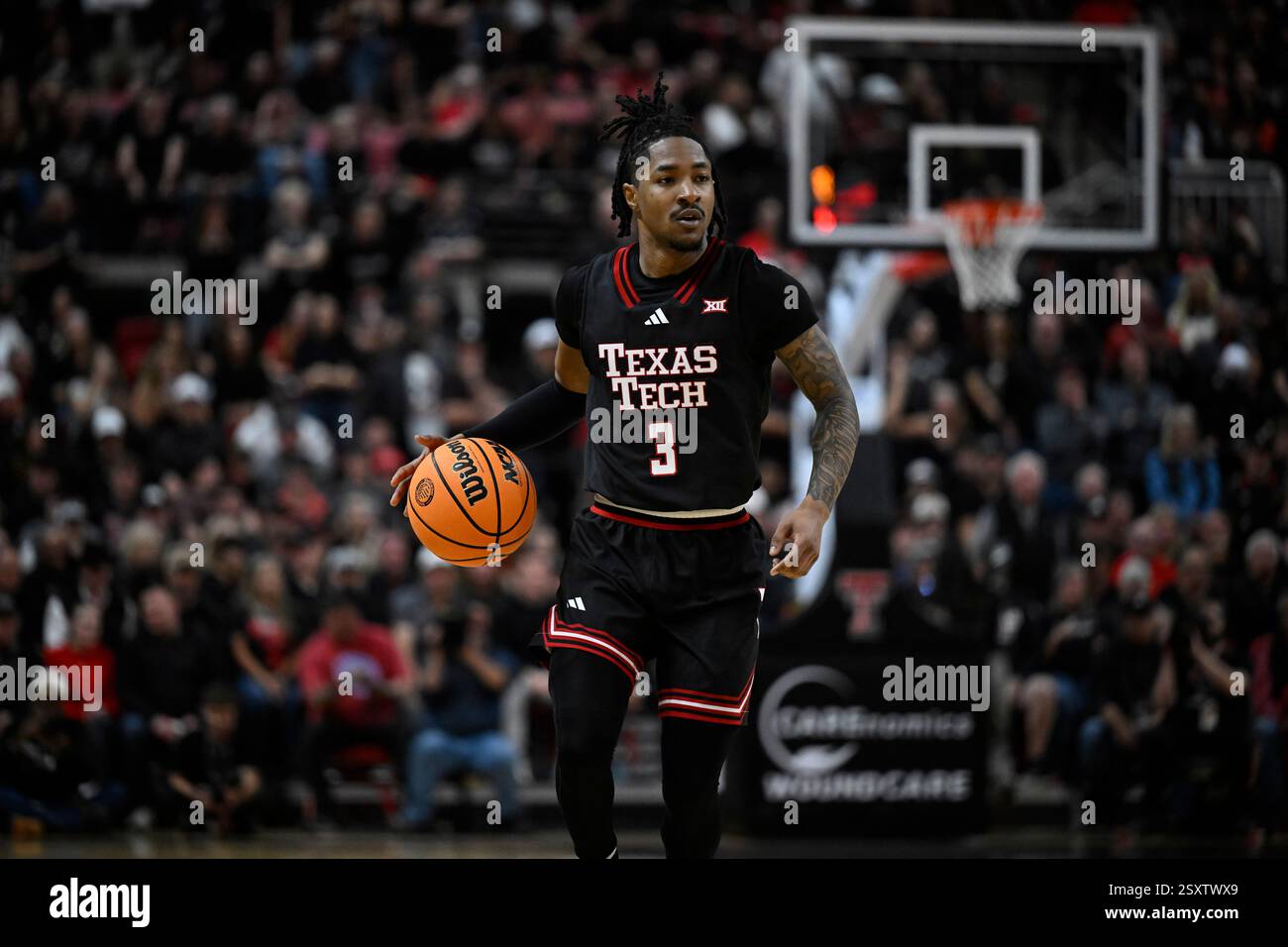 Texas Tech guard Elijah Hawkins (3) brings the ball up court against ...